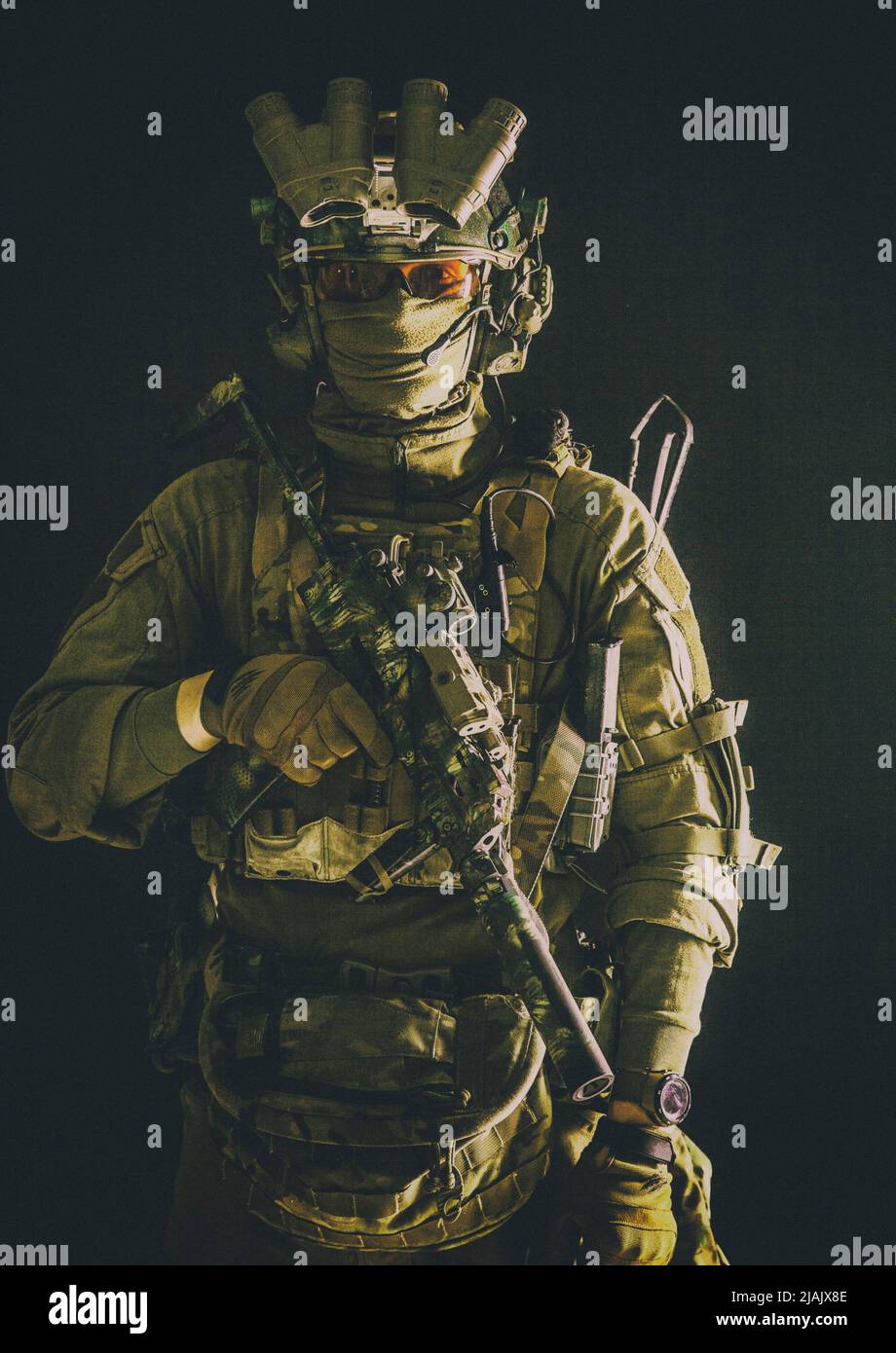 Special forces soldier in combat uniform, equipped with a mini ...