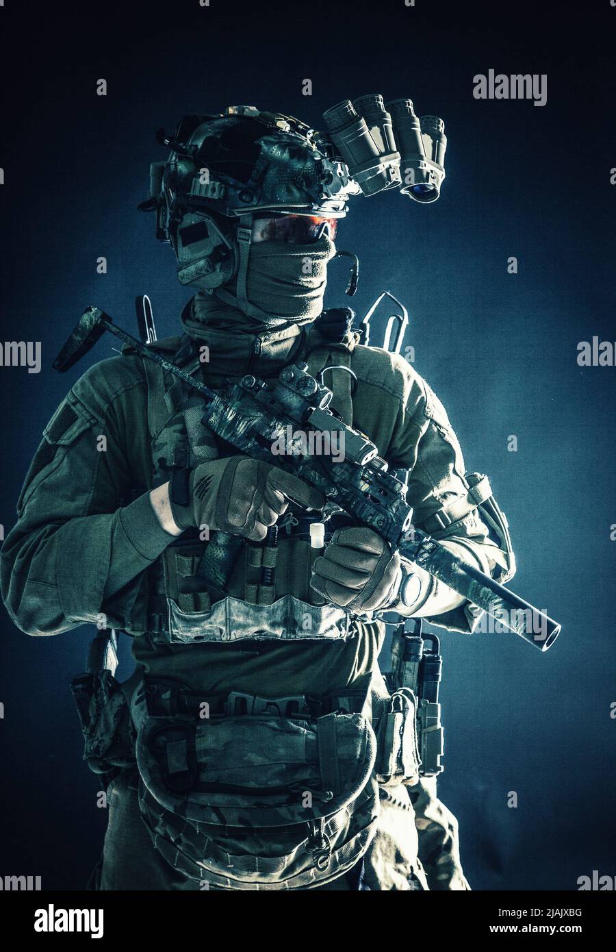 Special forces soldier in combat uniform, equipped with a mini ...