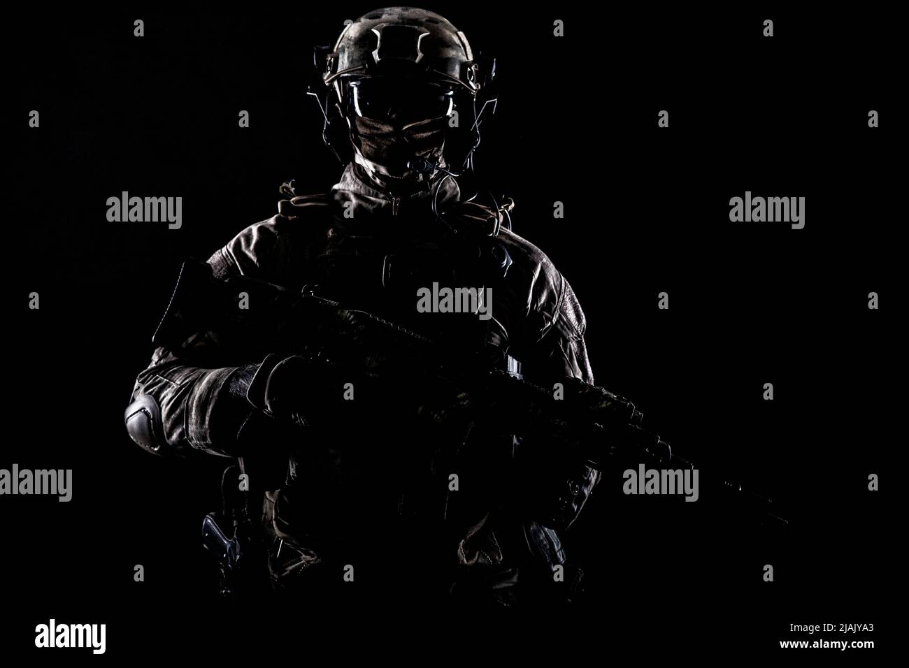 Special operations forces soldier wearing mask, armed with submachine ...