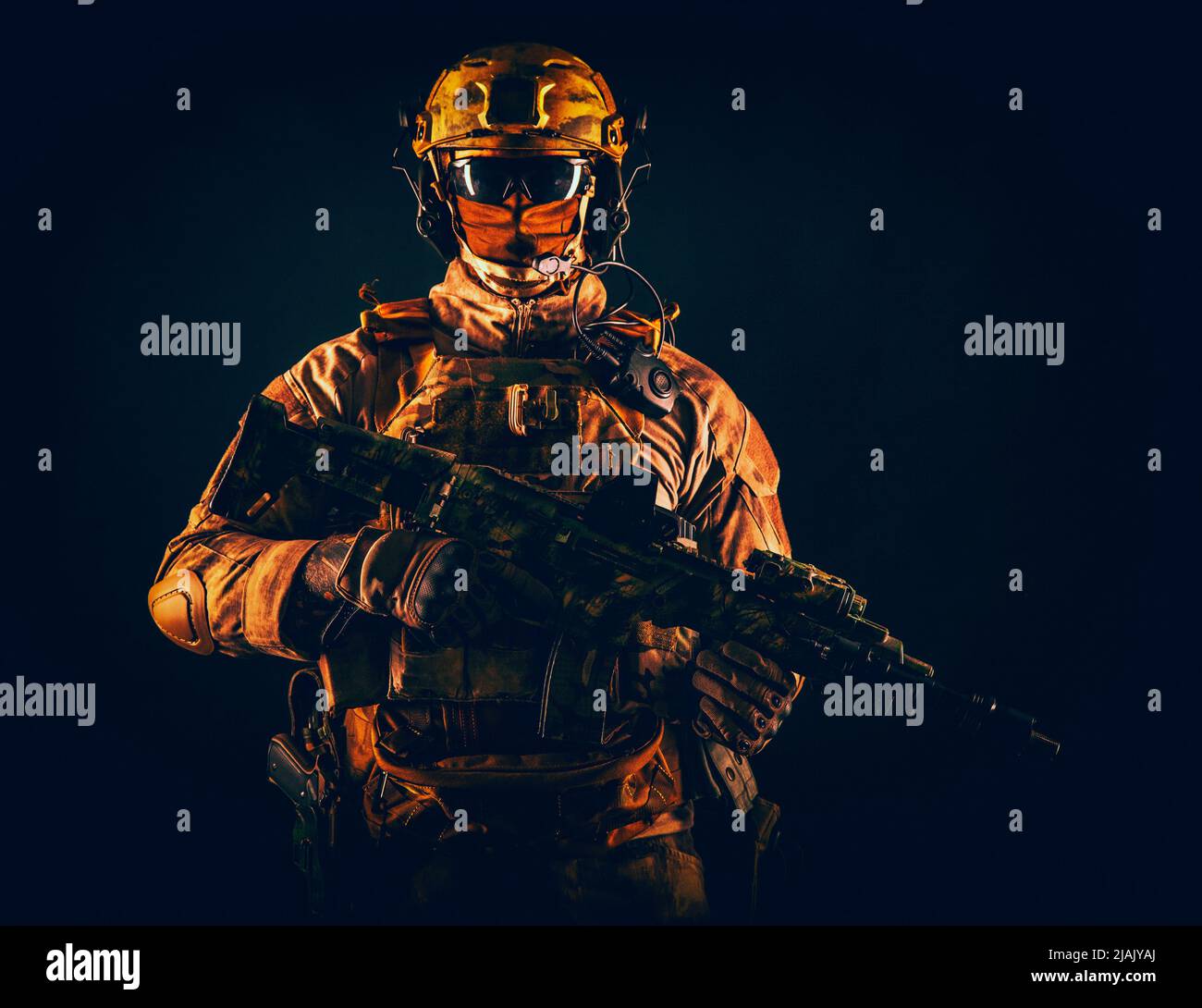 Special operations forces soldier wearing mask, armed with submachine ...