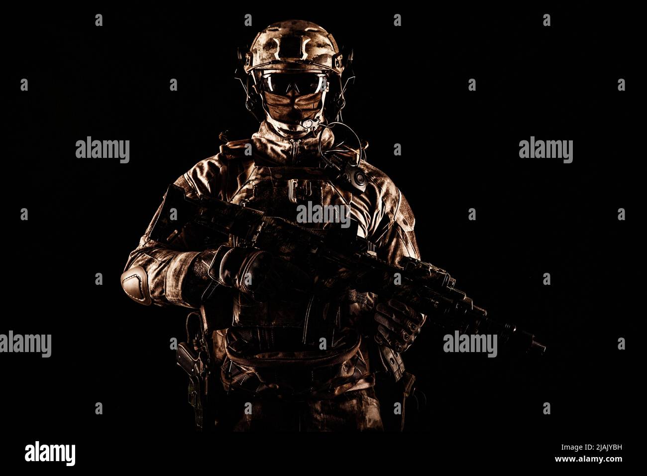 Special operations forces soldier wearing mask, armed with submachine ...