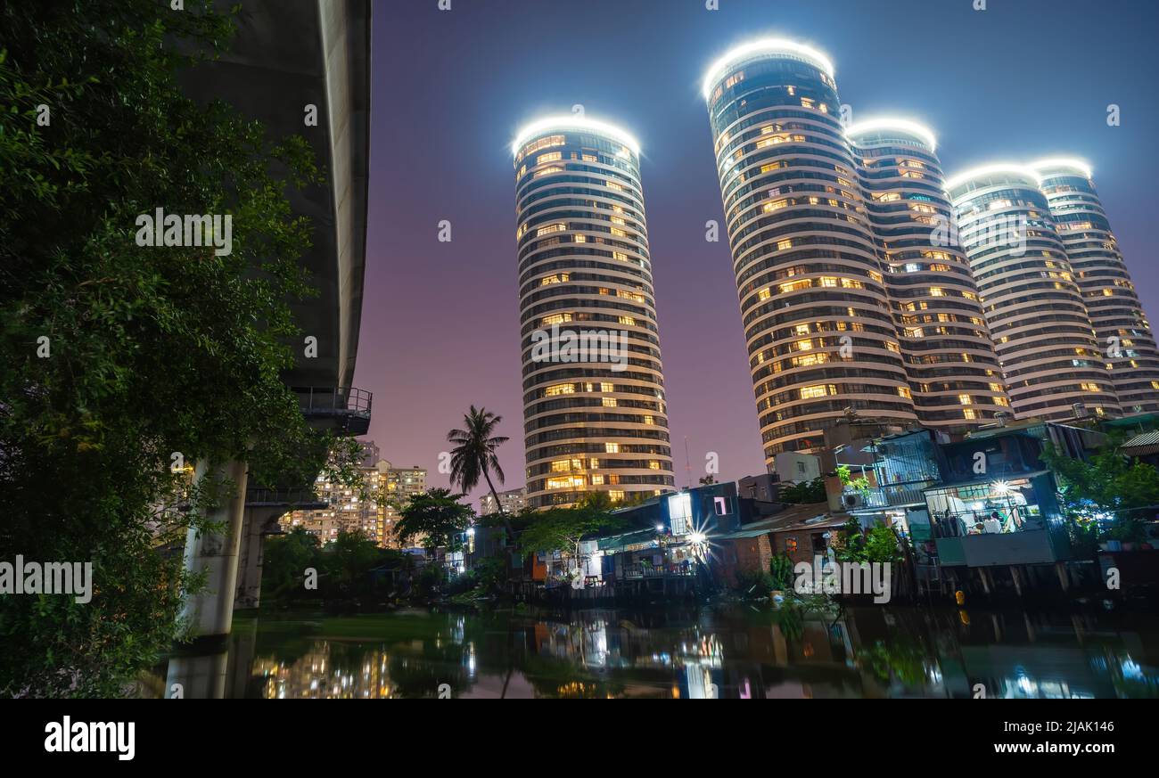 A contrast scene between new modern buildings and slums in developing ...