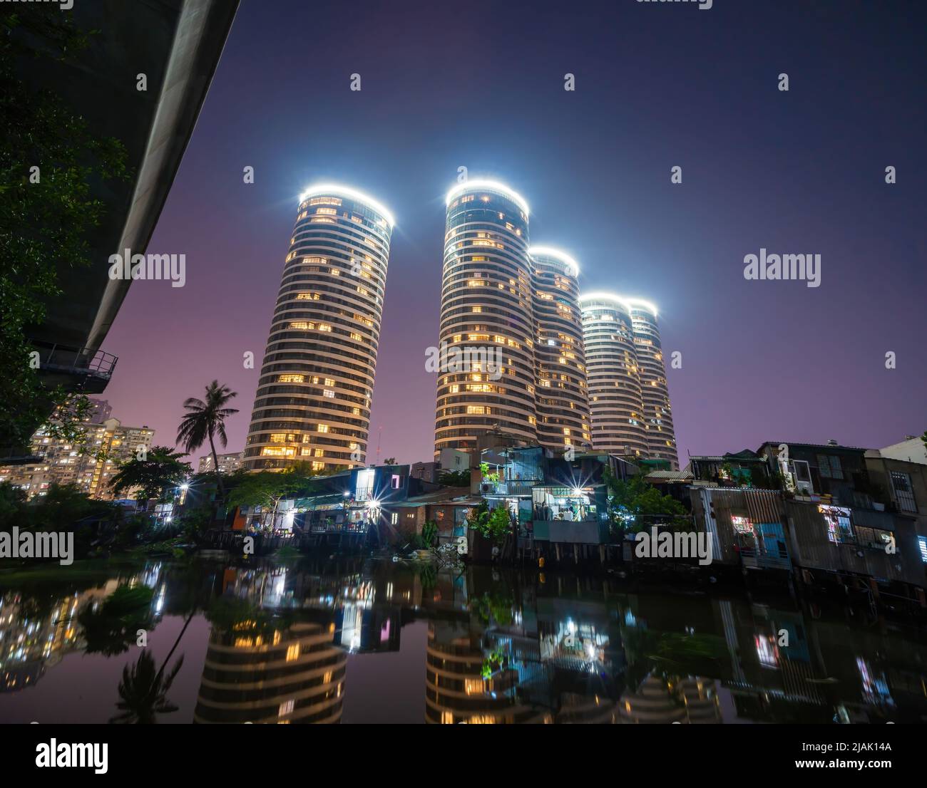 A contrast scene between new modern buildings and slums in developing ...