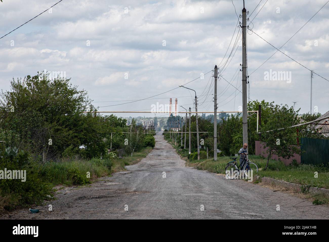 Siversk, Ukraine. 28th May, 2022. A man is seen with a bicycle in the ...