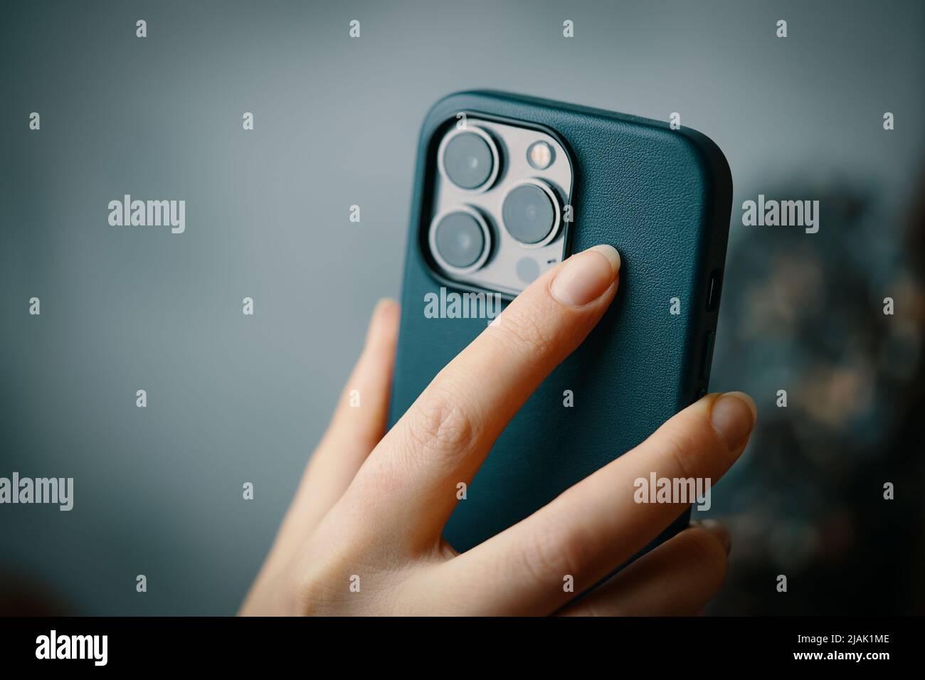 Female's hands with iPhone 13 pro Stock Photo - Alamy