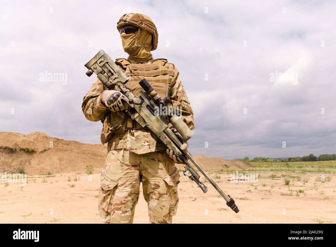 Fully equipped and armed special forces soldier with sniper rifle in ...