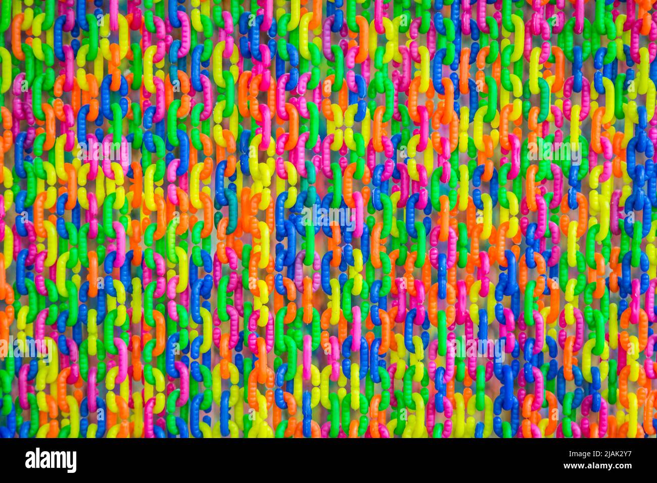 Colorful plastic chain background Stock Photo - Alamy