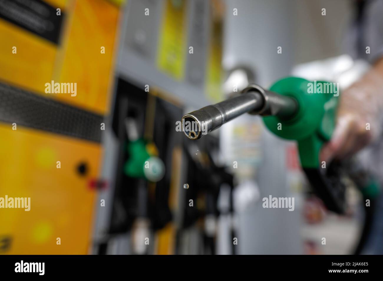 Shallow depth of field (selective focus) details with a man holding a ...