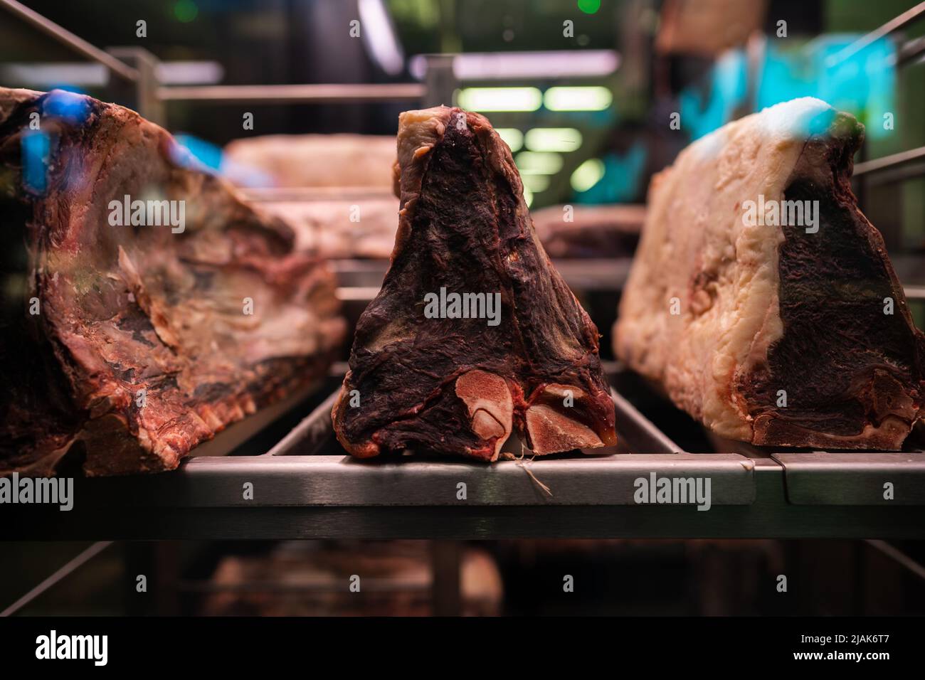 Fresh raw steaks displays for sale in butchers shop Stock Photo - Alamy