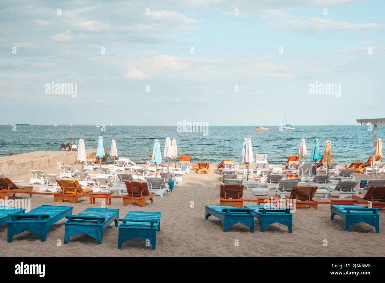 Sun loungers on the beach. Rest on the sea. Without people Stock Photo ...