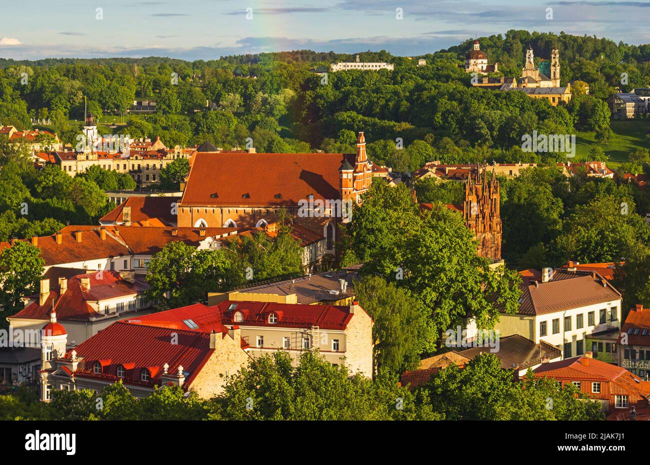 Rainbow over Vilnius old town, colorful evening view of Vilnius ...