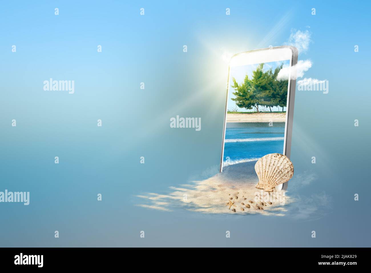 Mobile phone screen with a sandy beach with the blue ocean and blue sky ...