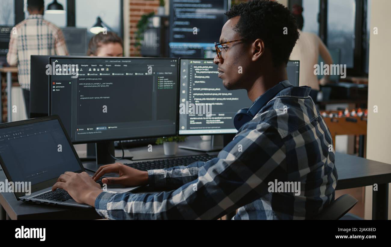 Focused programer fixing glasses typing hi-res stock photography and ...