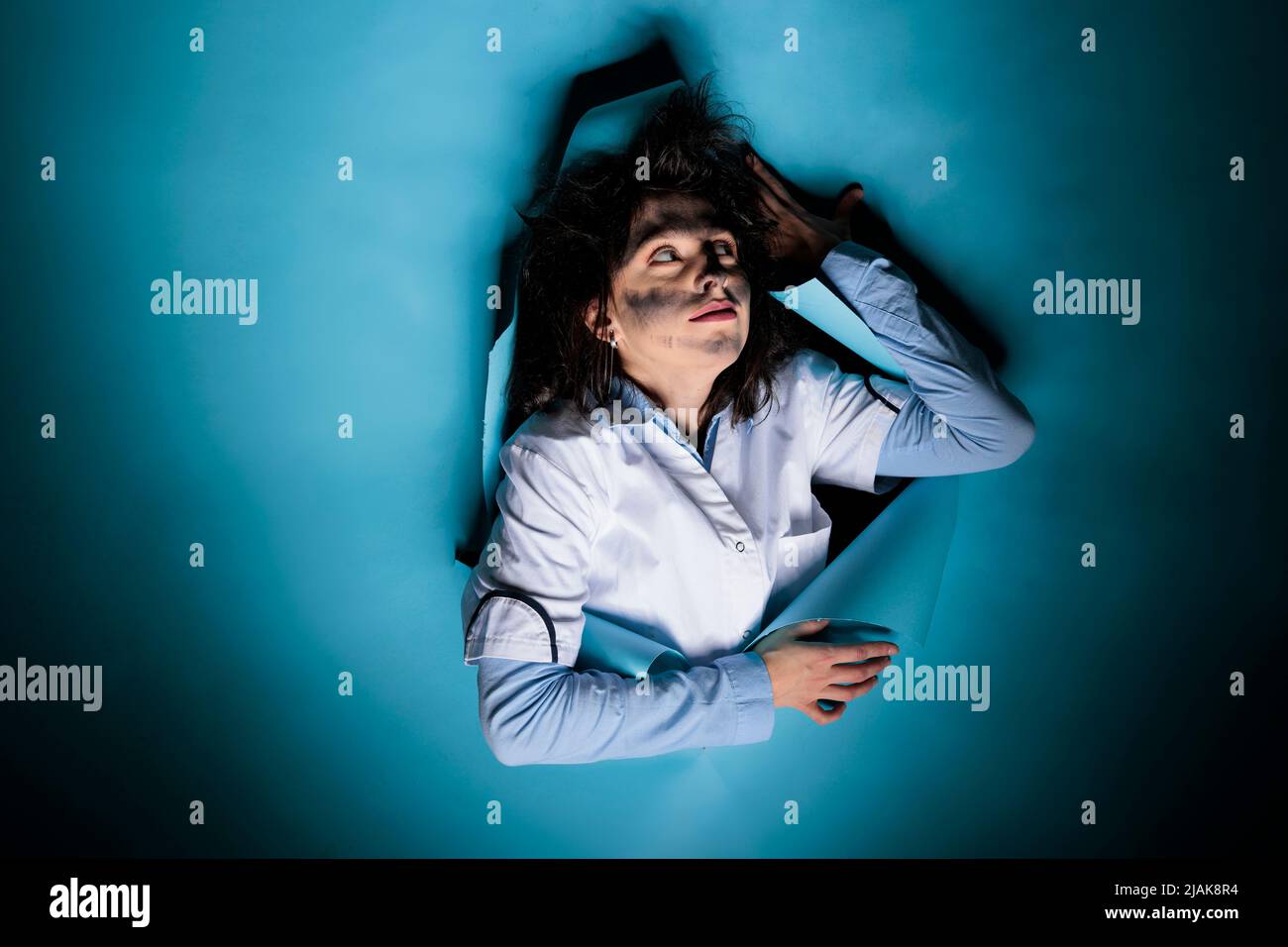 Crazy chemist with goofy appearance and messy hair after laboratory ...