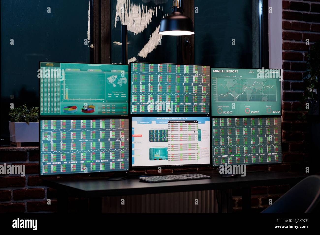 Empty trade office with nobody in it with screens showing financial ...