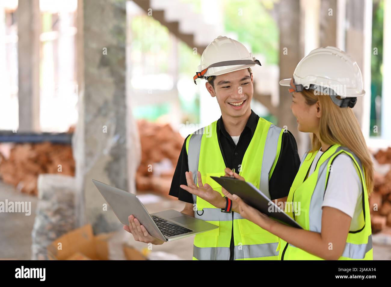 Team of civil engineer wearing uniform and safety helmet inspecting ...