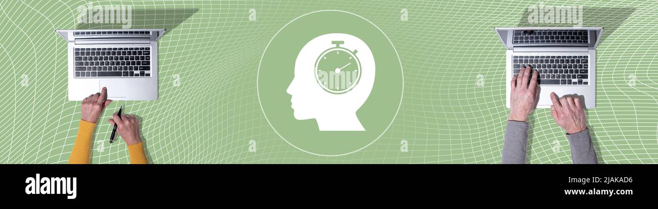 Top view of hands using laptop with symbol of time management concept ...