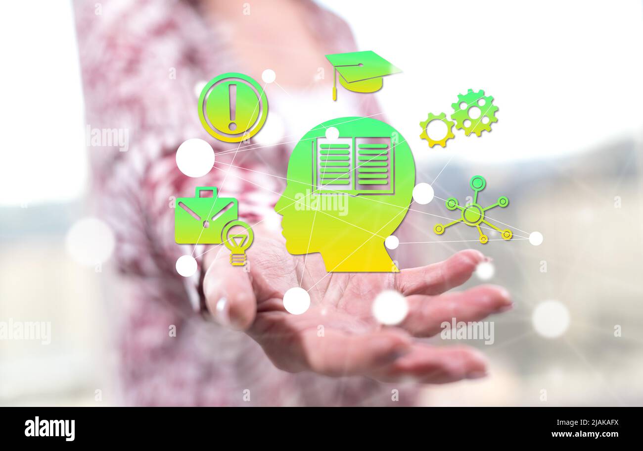 Knowledge concept above the hand of a woman in background Stock Photo ...