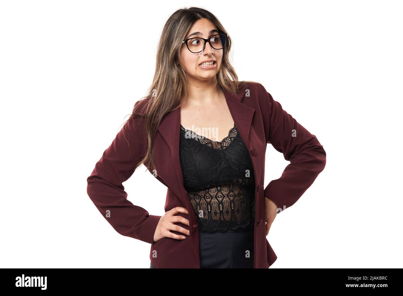 Young indian businesswoman with a shock expression on her face ...