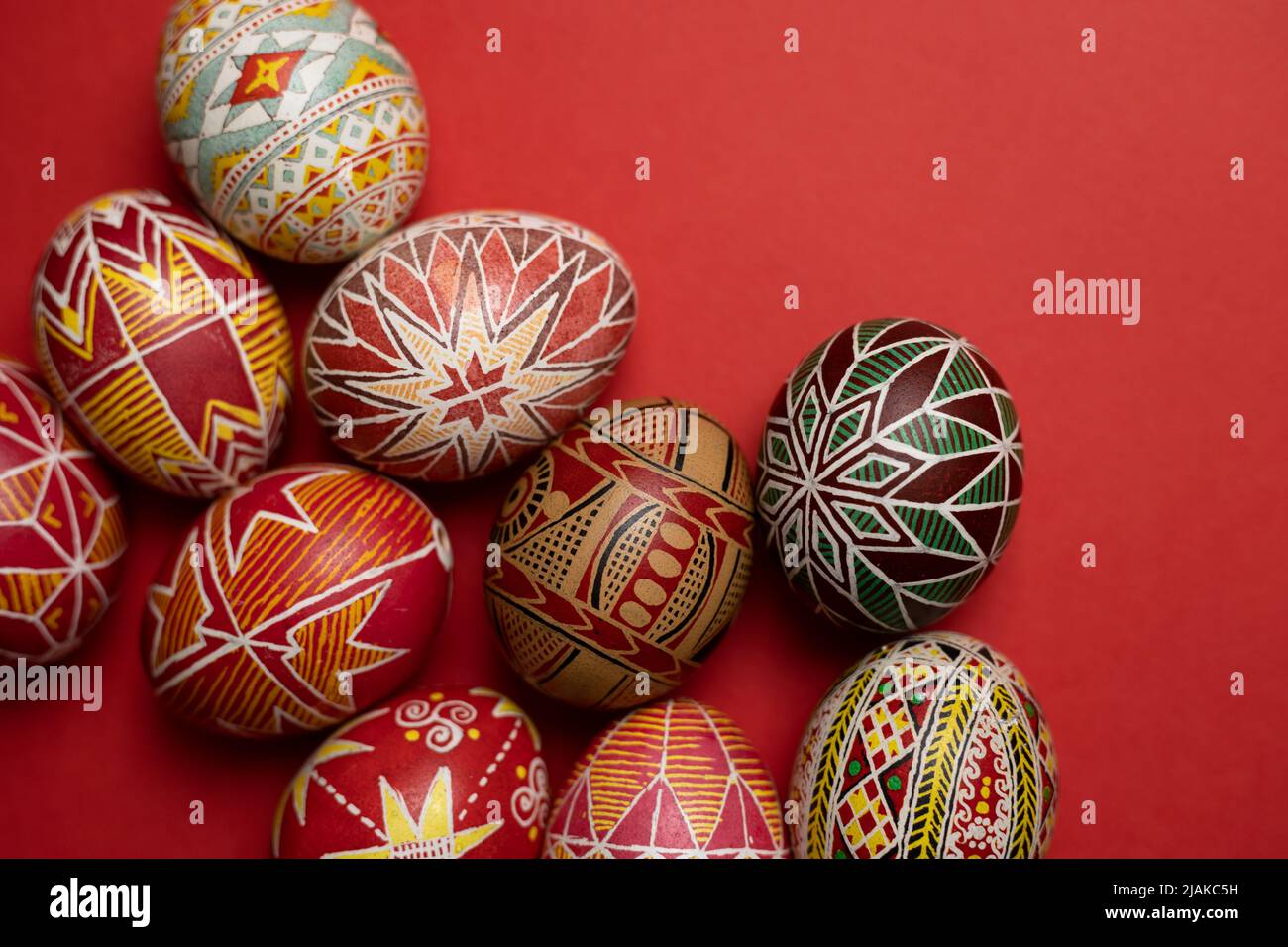 happy easter card. beautiful Easter egg Pysanka handmade on a red ...