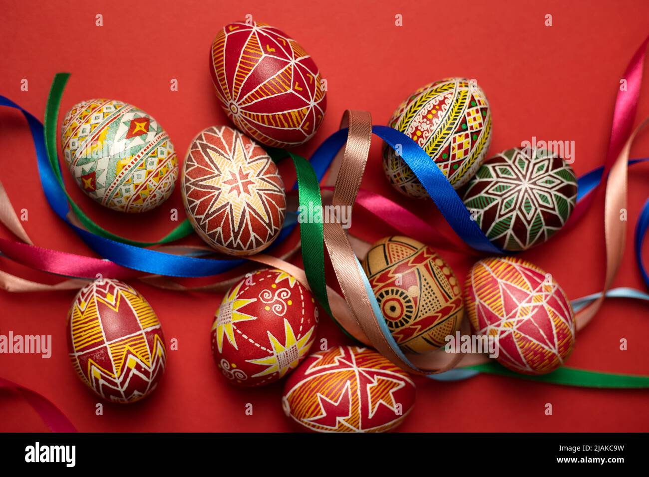 happy easter card. beautiful Easter egg Pysanka handmade on a red ...