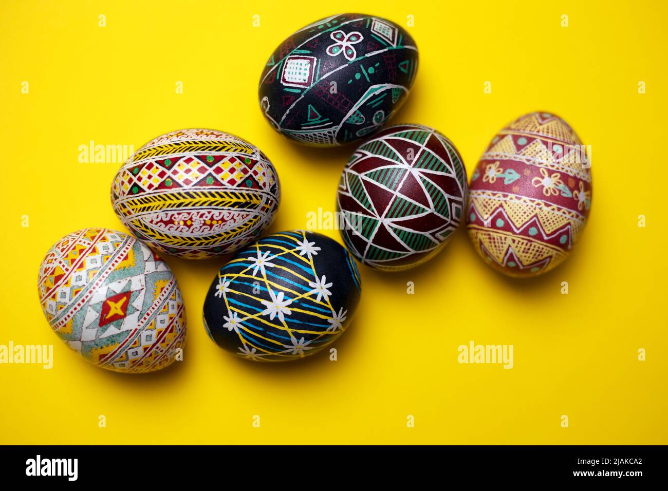 happy easter card. beautiful Easter egg Pysanka handmade on a yellow ...