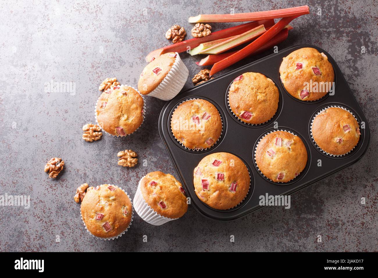 Rhubarb Walnut Muffins close-up in a baking dish on the table ...