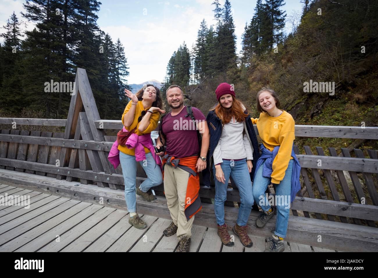 mountain trip. family against the backdrop of mountains. active ...