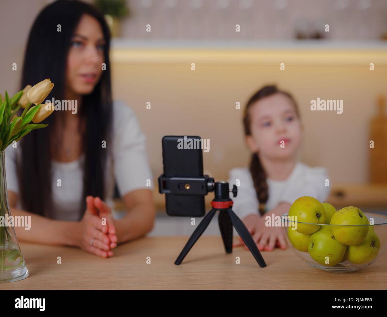 Blogger mom with her baby at home. Millennial Influencer woman creating ...