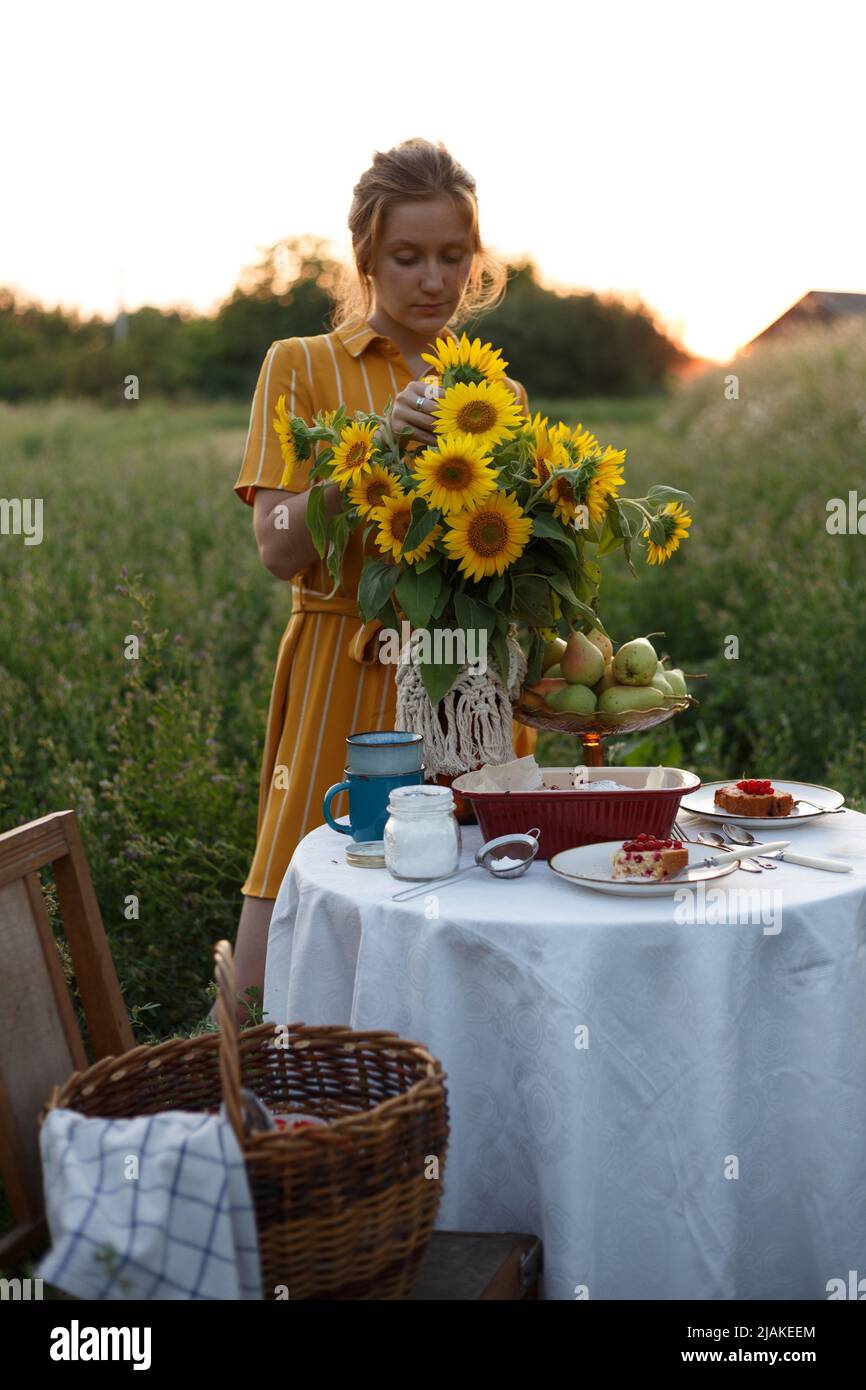 garden and still life. tea party in the garden - girl and bouquet with ...