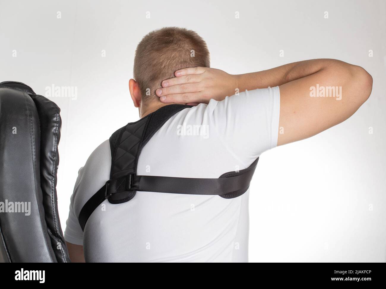 A male is wearing an orthopedic posture corrector. Treatment for stoop ...