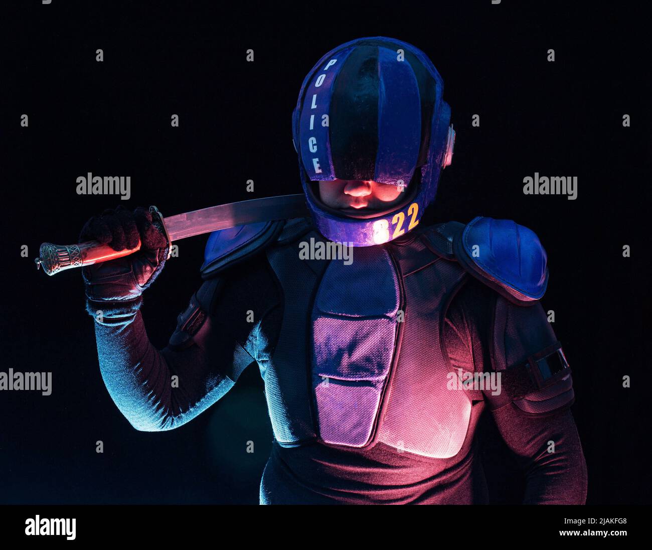 Robot cop pulls out short samurai sword and swings it, he stands in ...