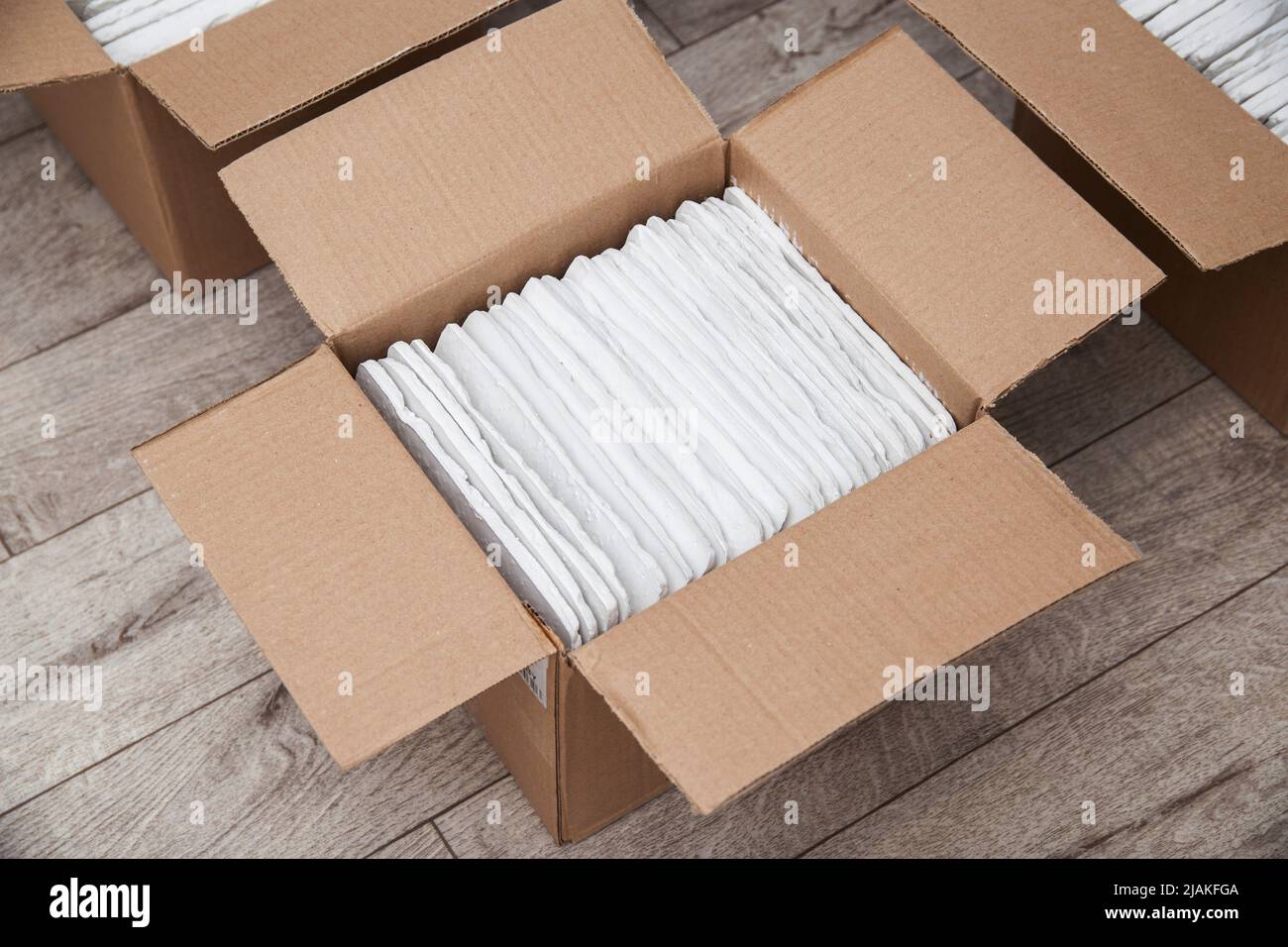 Cardboard box with a decorative stone made of plaster in the form of a ...
