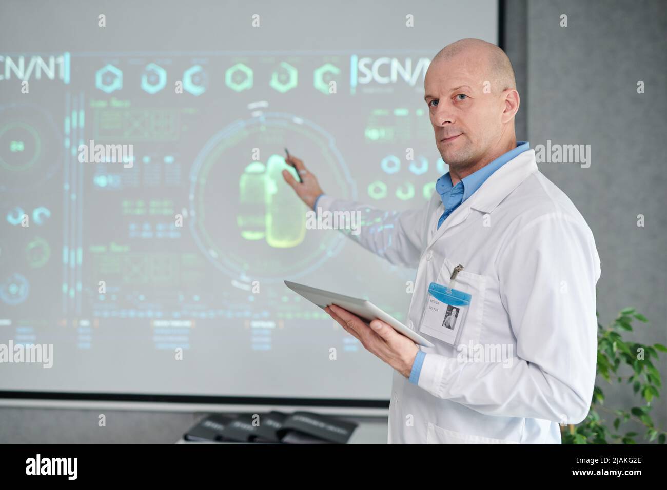 Teacher pointing projector screen hi-res stock photography and images ...
