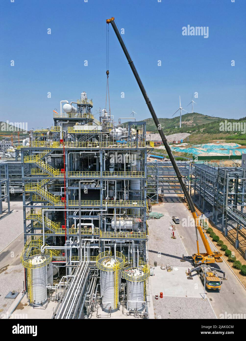 YANTAI, CHINA - MAY 31, 2022 - Cranes are hoisting chemical equipment ...
