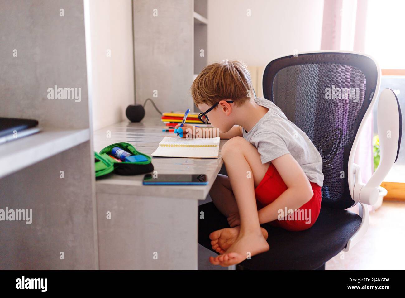School DAYS. Random kin doing his homework Stock Photo - Alamy