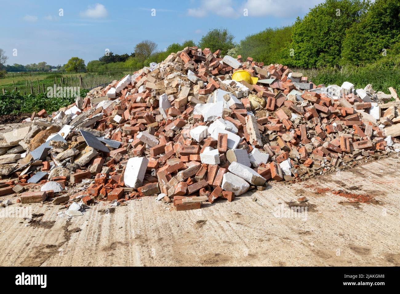 A pile of hardcore broken bricks and stone rubble, Suffolk, England, UK ...
