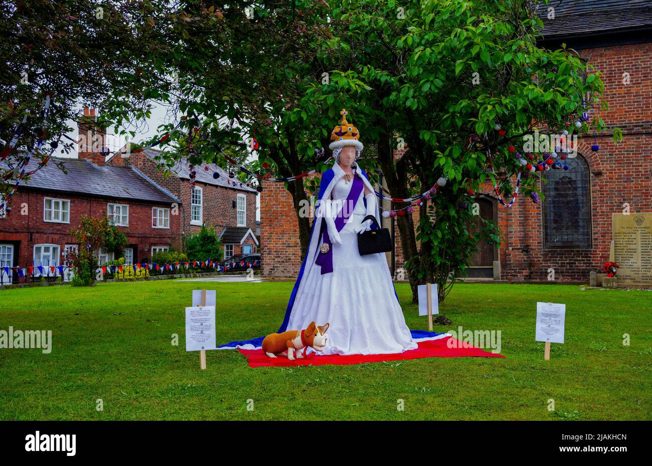 A life size knitted Queen and corgi in the village of Holmes Chapel in ...