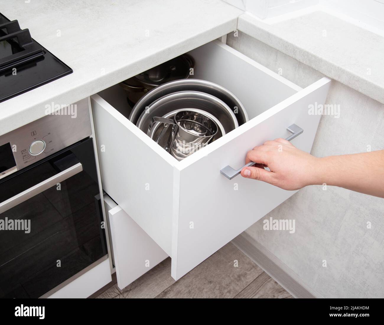Modern sliding drawer system in the kitchen. Production of kitchen ...