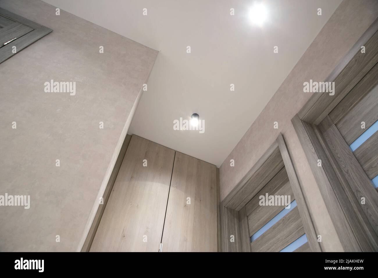 Modern renovation and design in the hallway. Black LED spotlights on ...