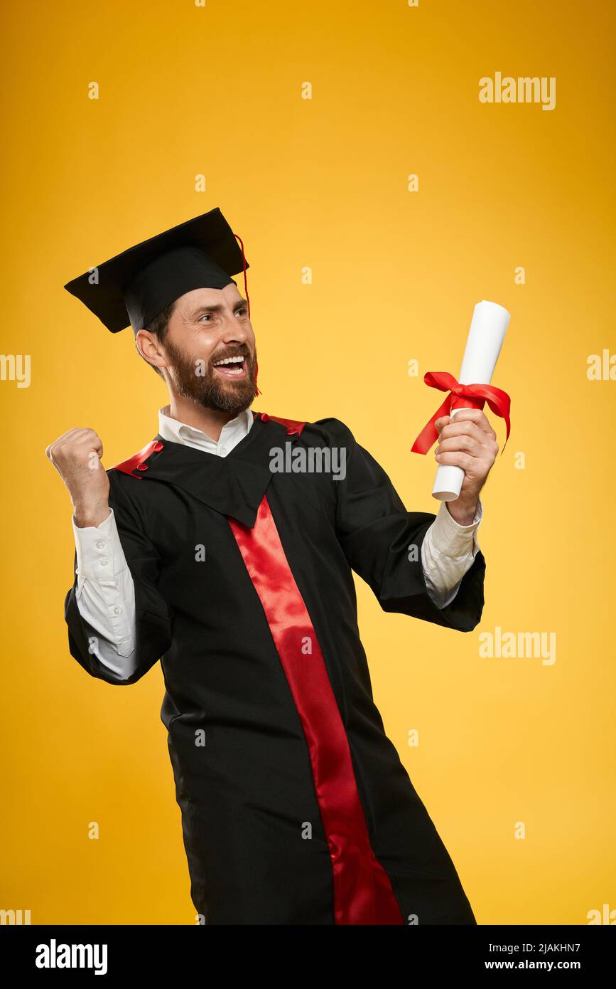 Bachelor, master graduating from university. Handsome boy with beard ...