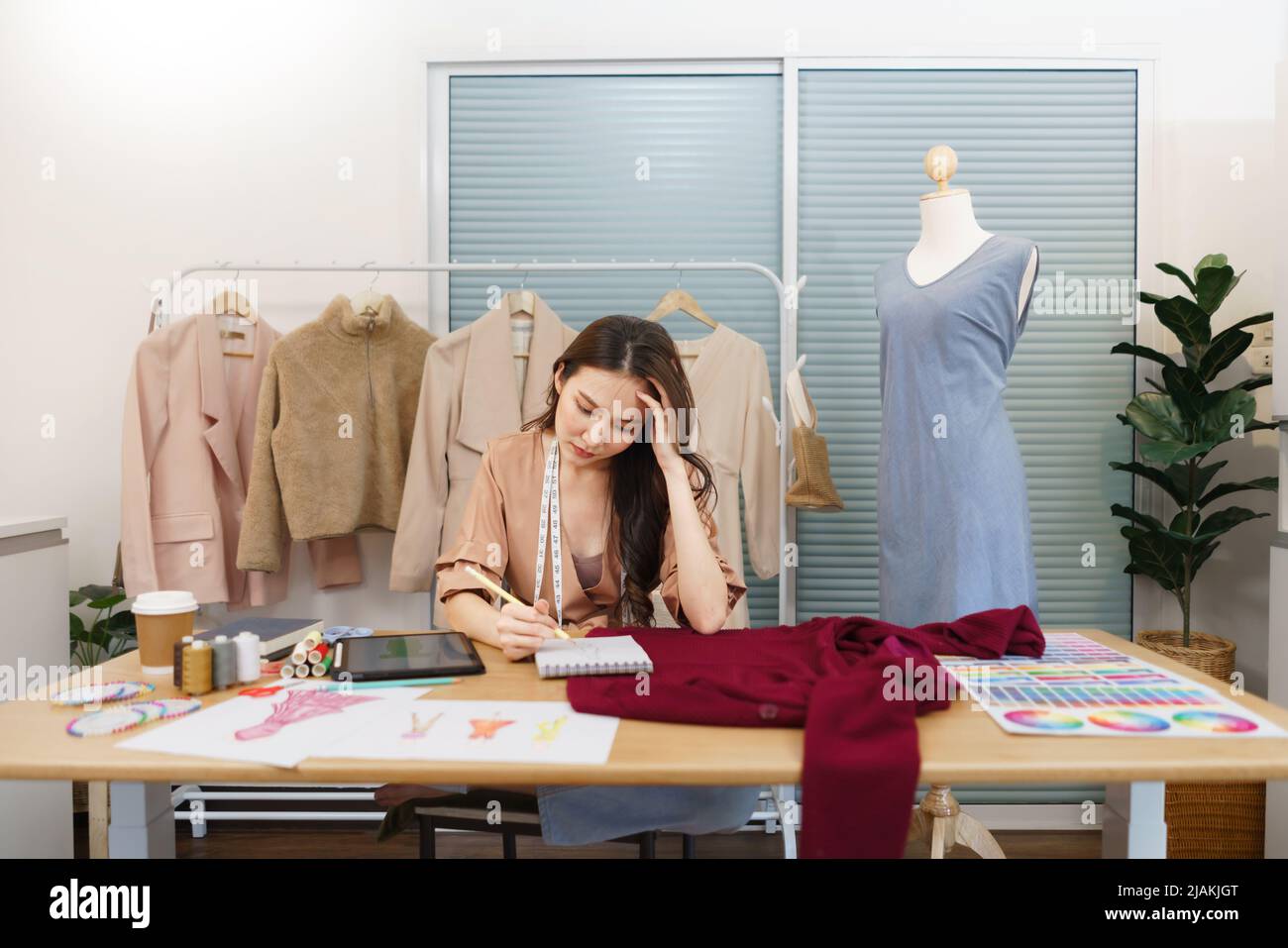 Fashion design concept, Asian female designer feeling stress while ...