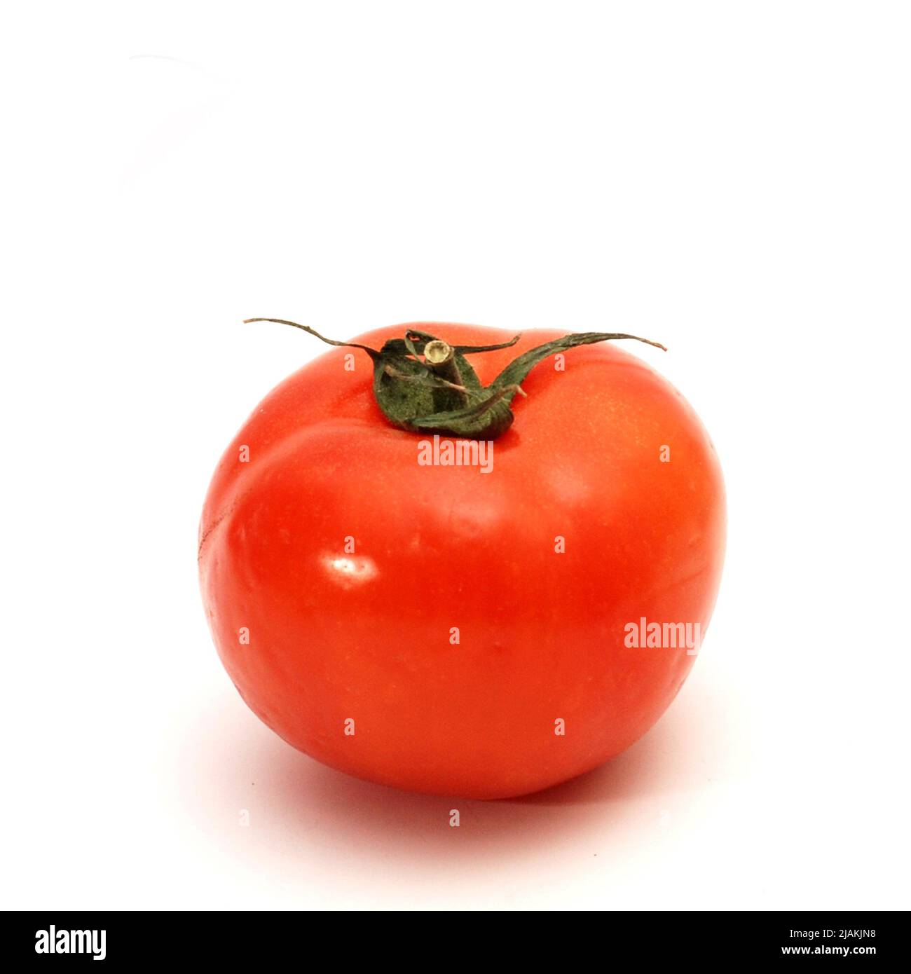 ripe red tomato on white Stock Photo - Alamy
