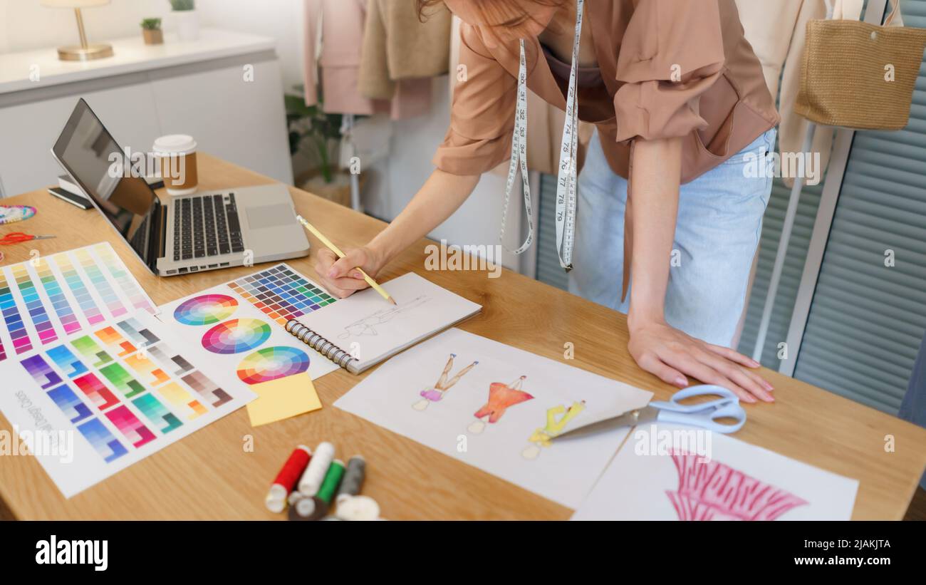 Fashion design concept, Asian female fashion designer sketching new ...