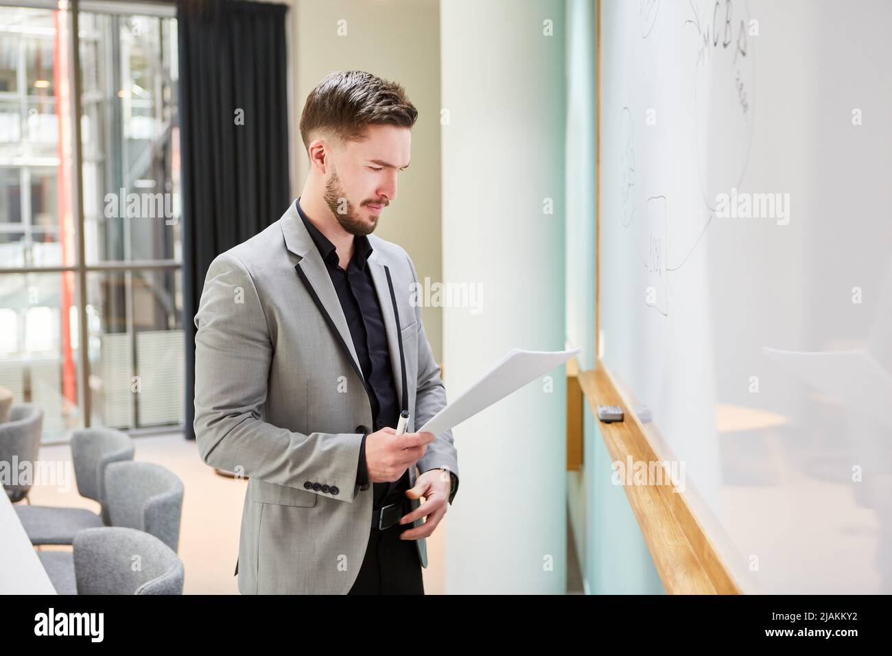 Young scientist as a speaker with papers for a lecture on the ...
