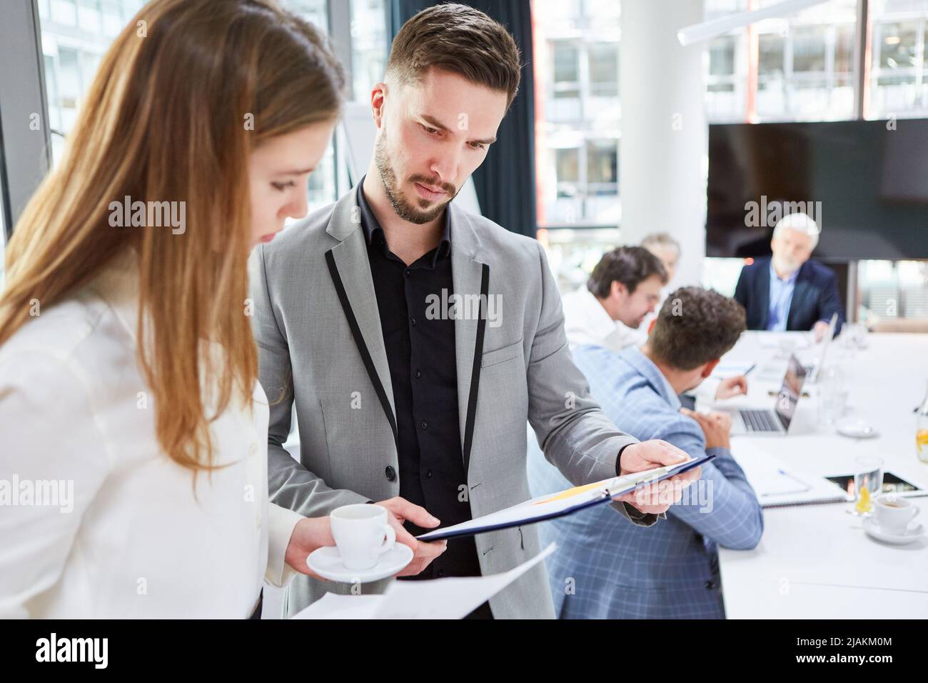 Two young woman working with papers hi-res stock photography and images ...
