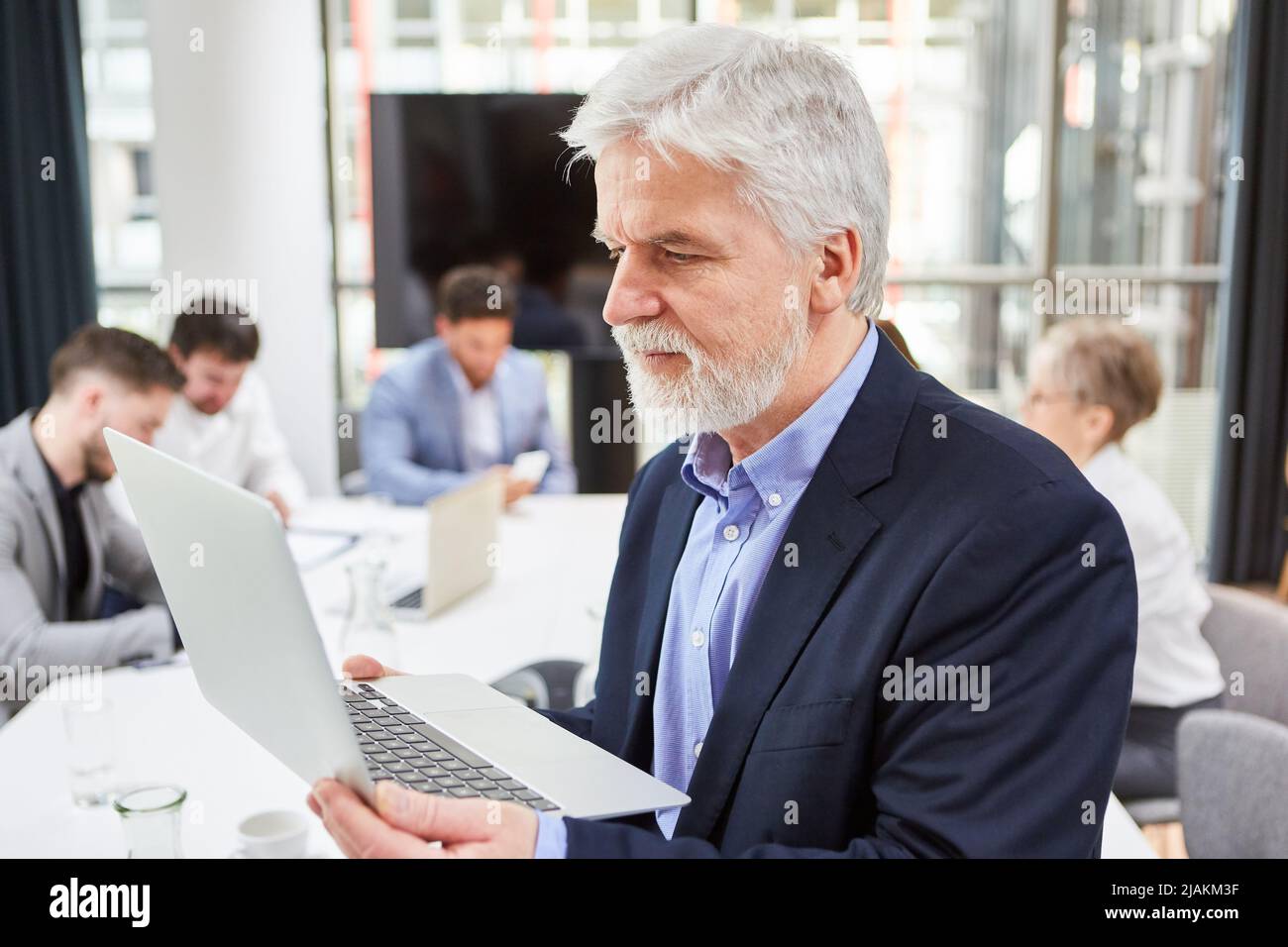 Elderly businessman working computer in hi-res stock photography and ...