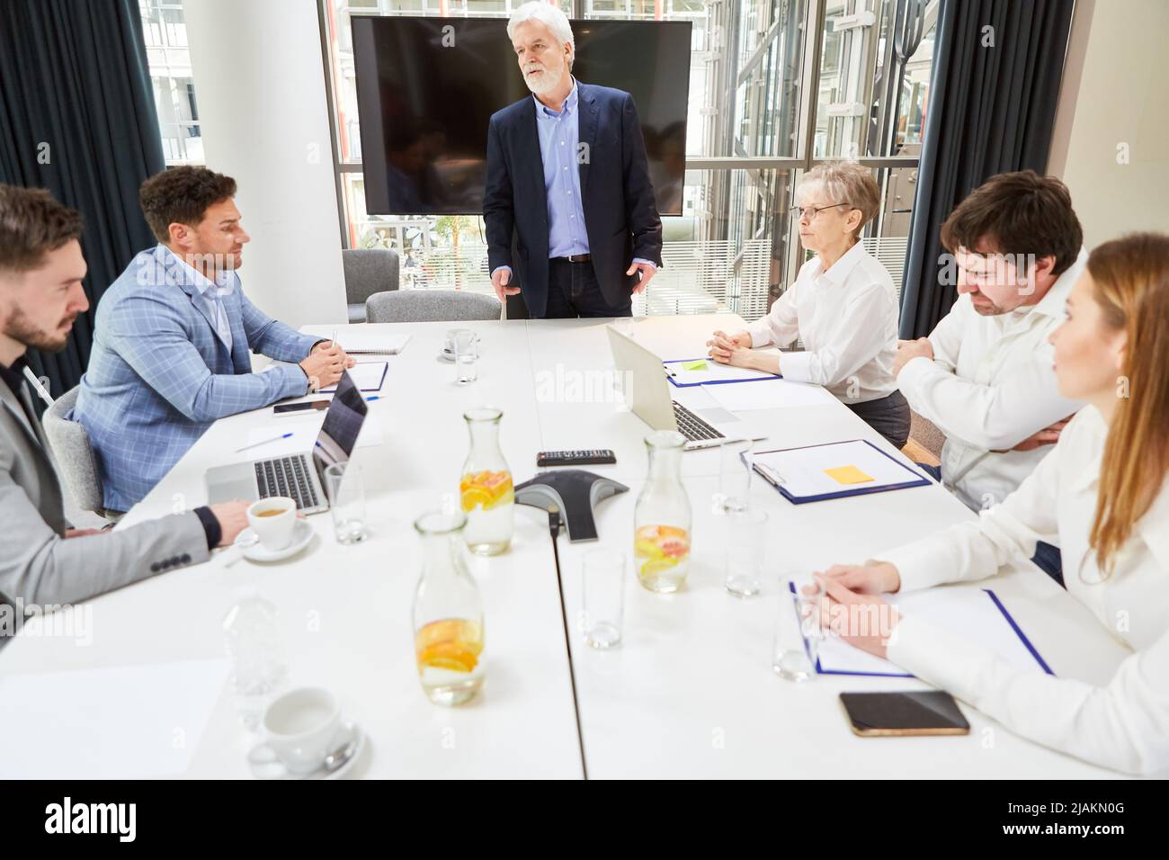 Experienced CEO or manager in a consulting meeting or training Stock ...