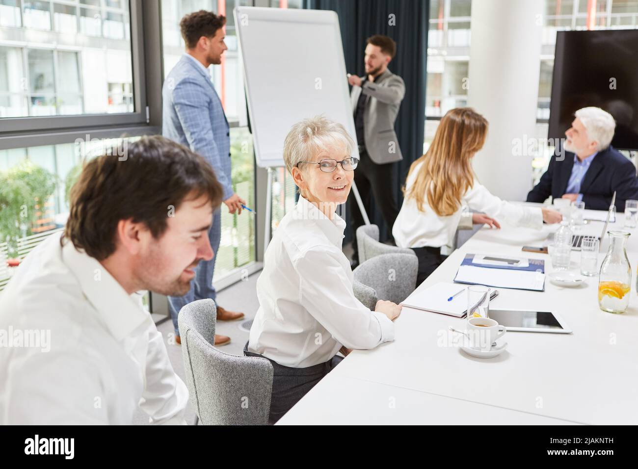 Business consultant at the flipchart in a consulting workshop during a ...