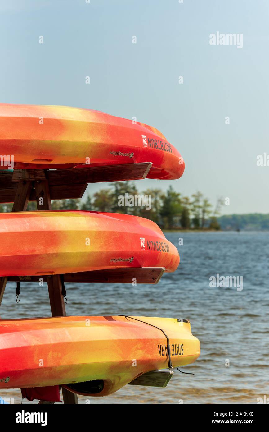 Ludington, MI - May 21, 2022: Colorful rental kayaks stored on a beach ...